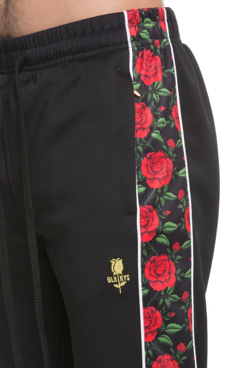 THE TRADE COLLECTIVE The Rose Pattern Track Pants in Black Floral ...